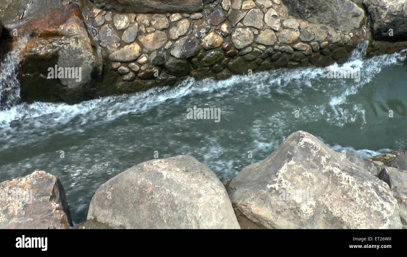 Cool water and large rocks of a mountain river Stock Photo - Alamy