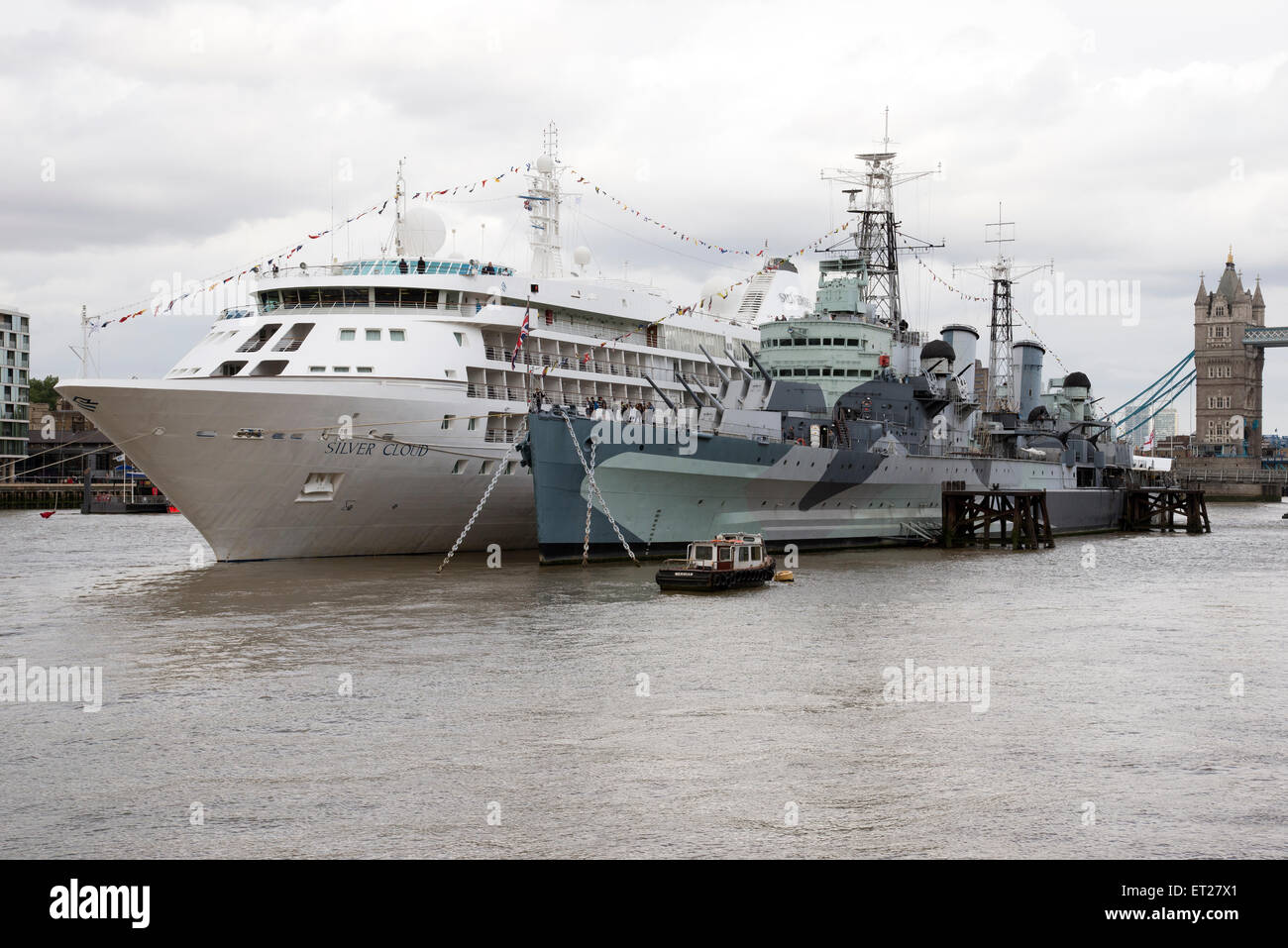 Cruise ship berthed next to HMS Belfast on the River Thames London UK ...