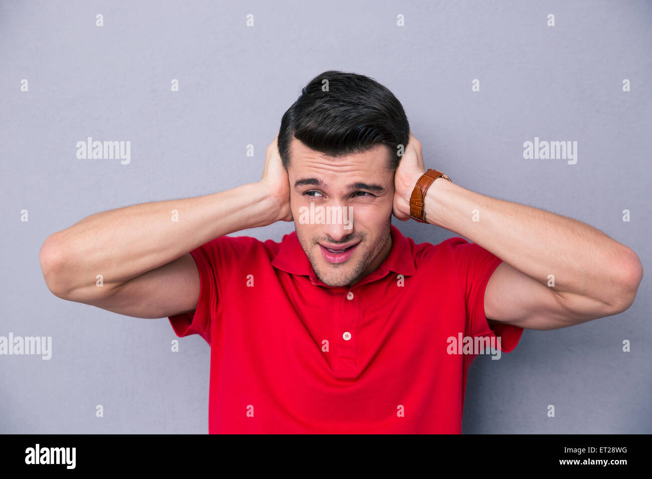 Boy with hands over his ears hi-res stock photography and images - Alamy