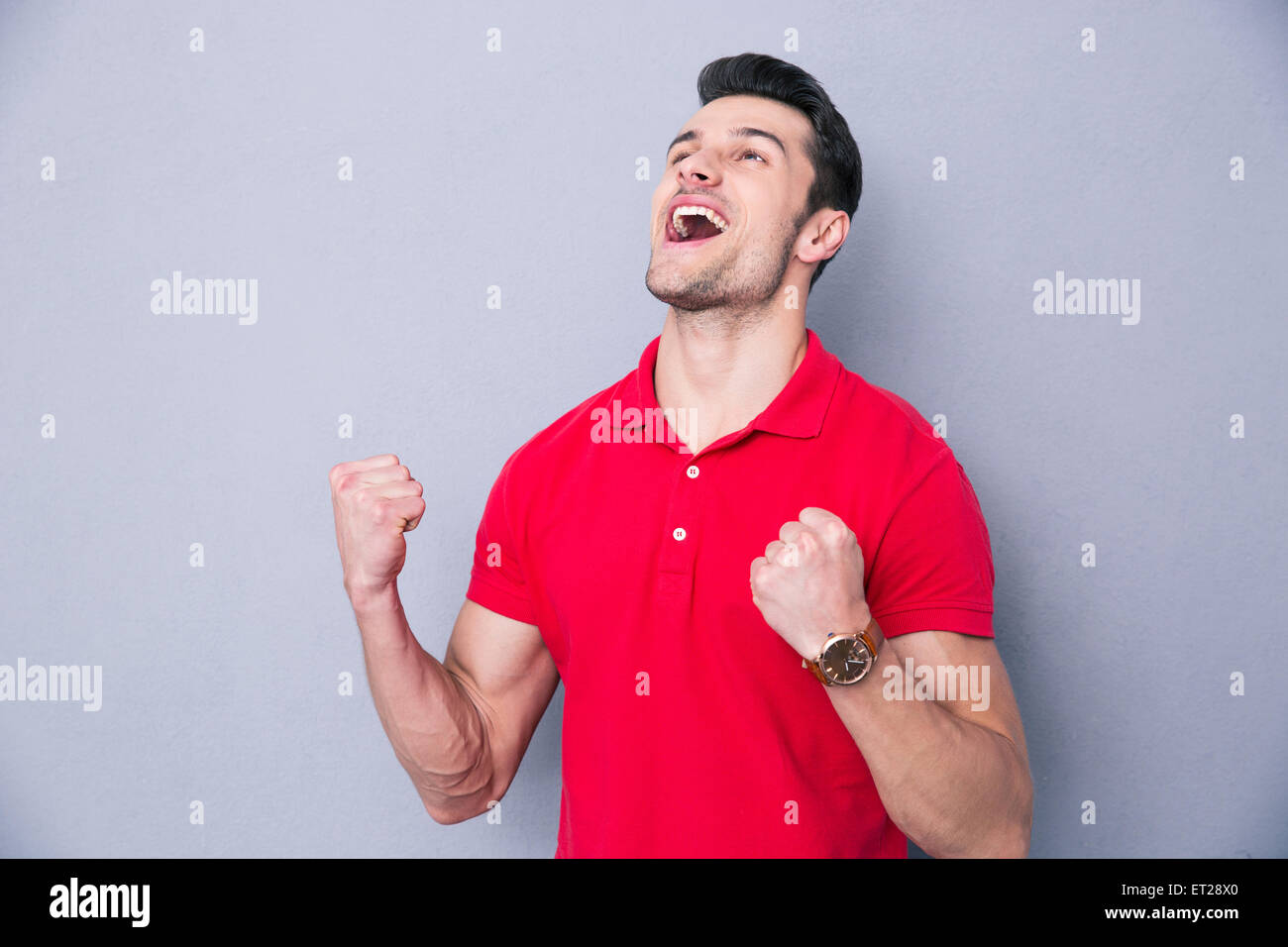 Happy man celebrating victory over hi-res stock photography and images ...