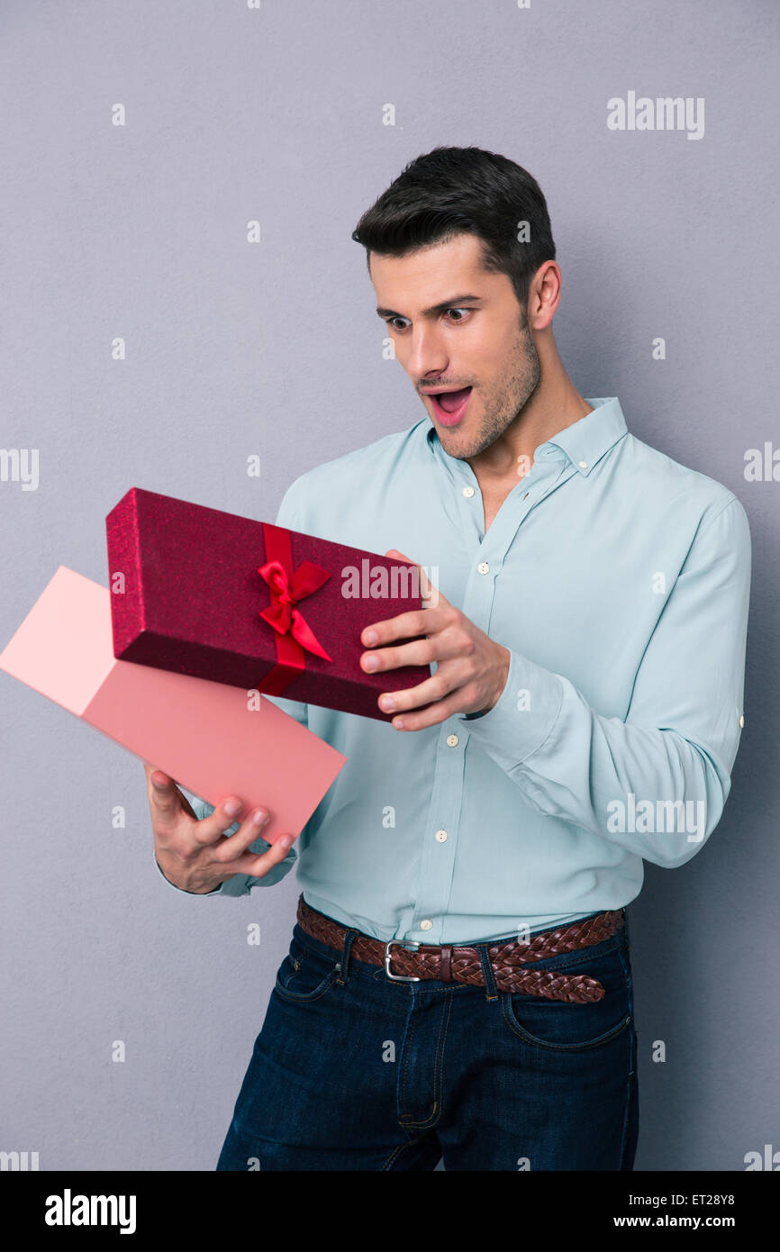 Happy brunette opening box hi-res stock photography and images - Alamy