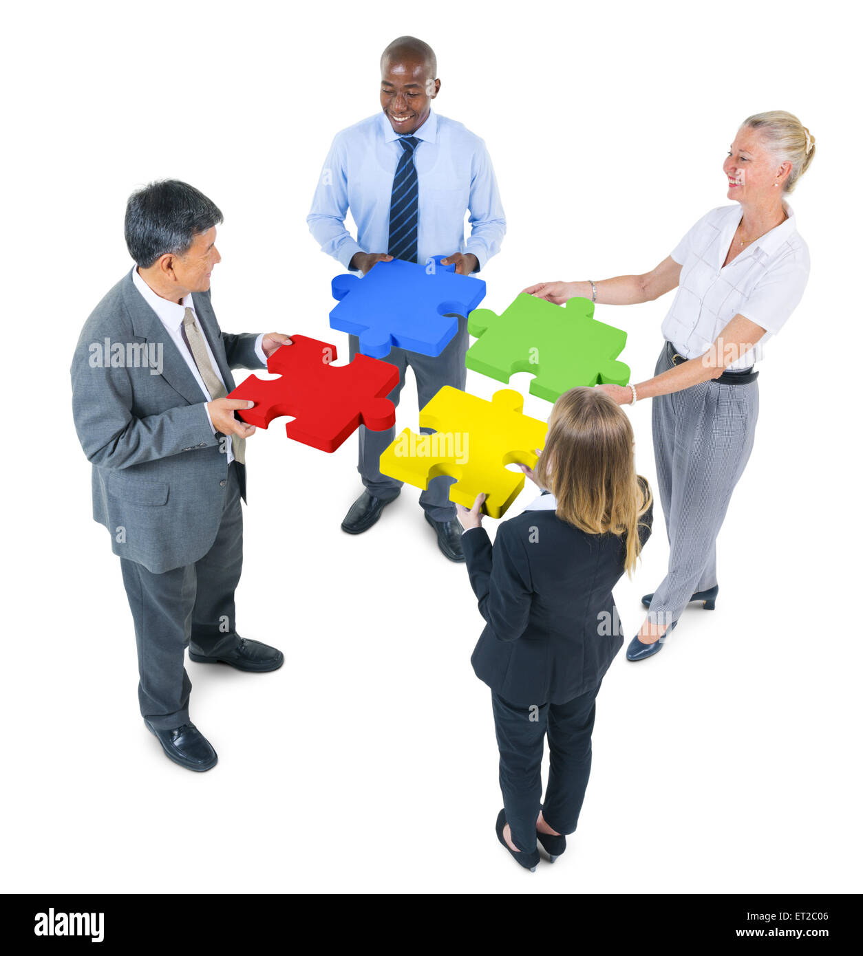 Group of Business People Building Jigsaw Stock Photo - Alamy