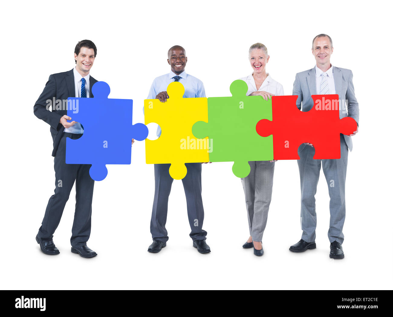 Group of Business People Building Jigsaw Stock Photo - Alamy
