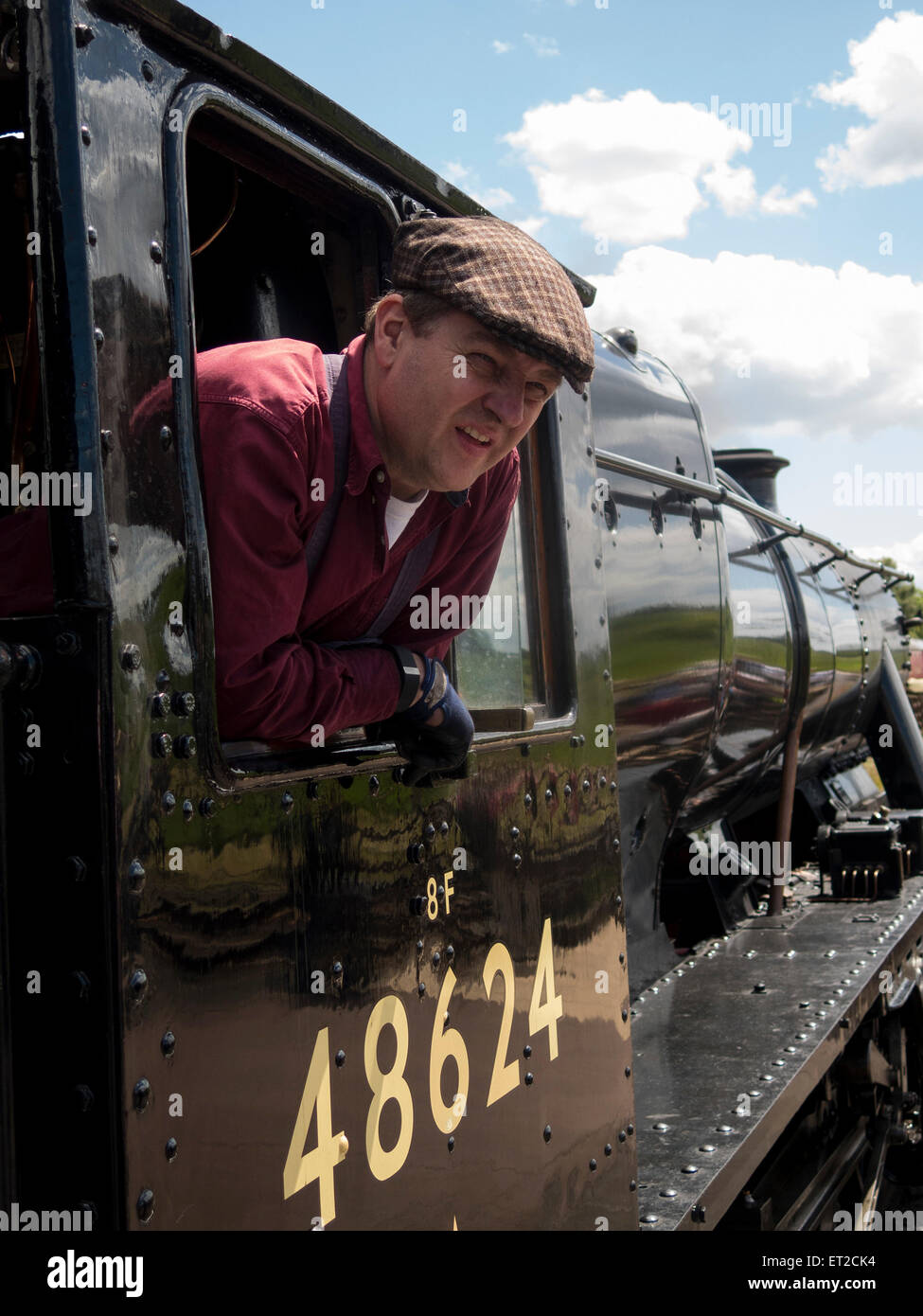engine driver of a vintage steam locomotive at Loughborough station, on ...