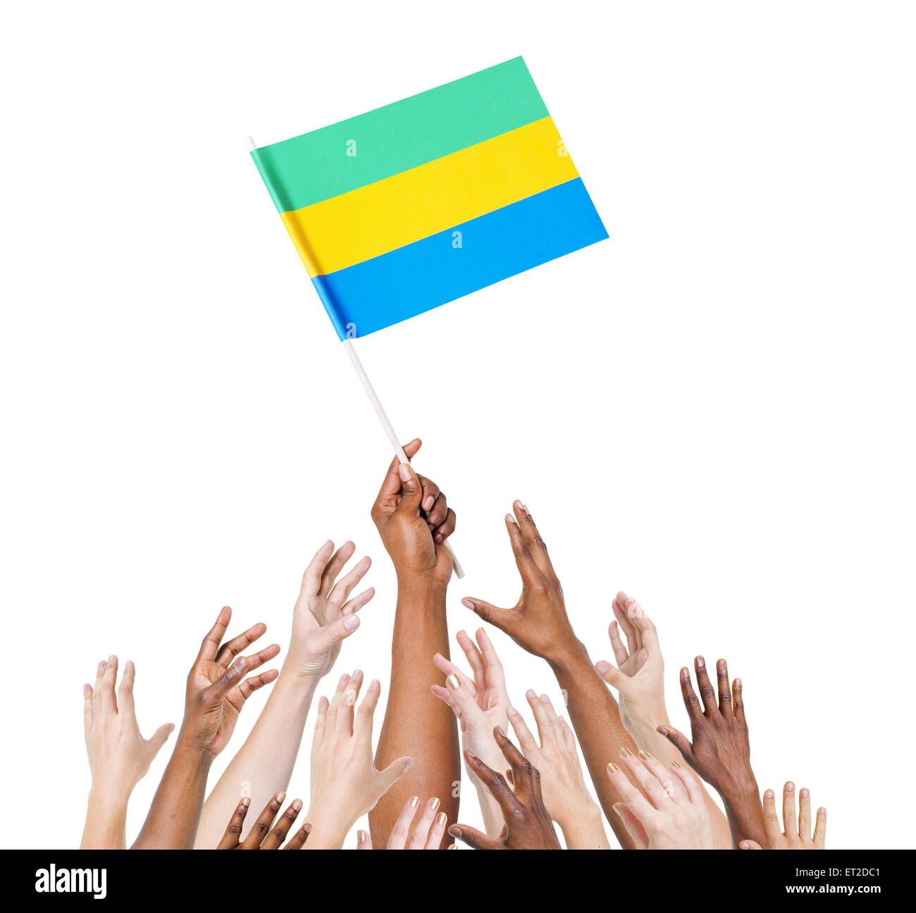 Group of multi-ethnic people reaching for and holding the flag of Gabon ...