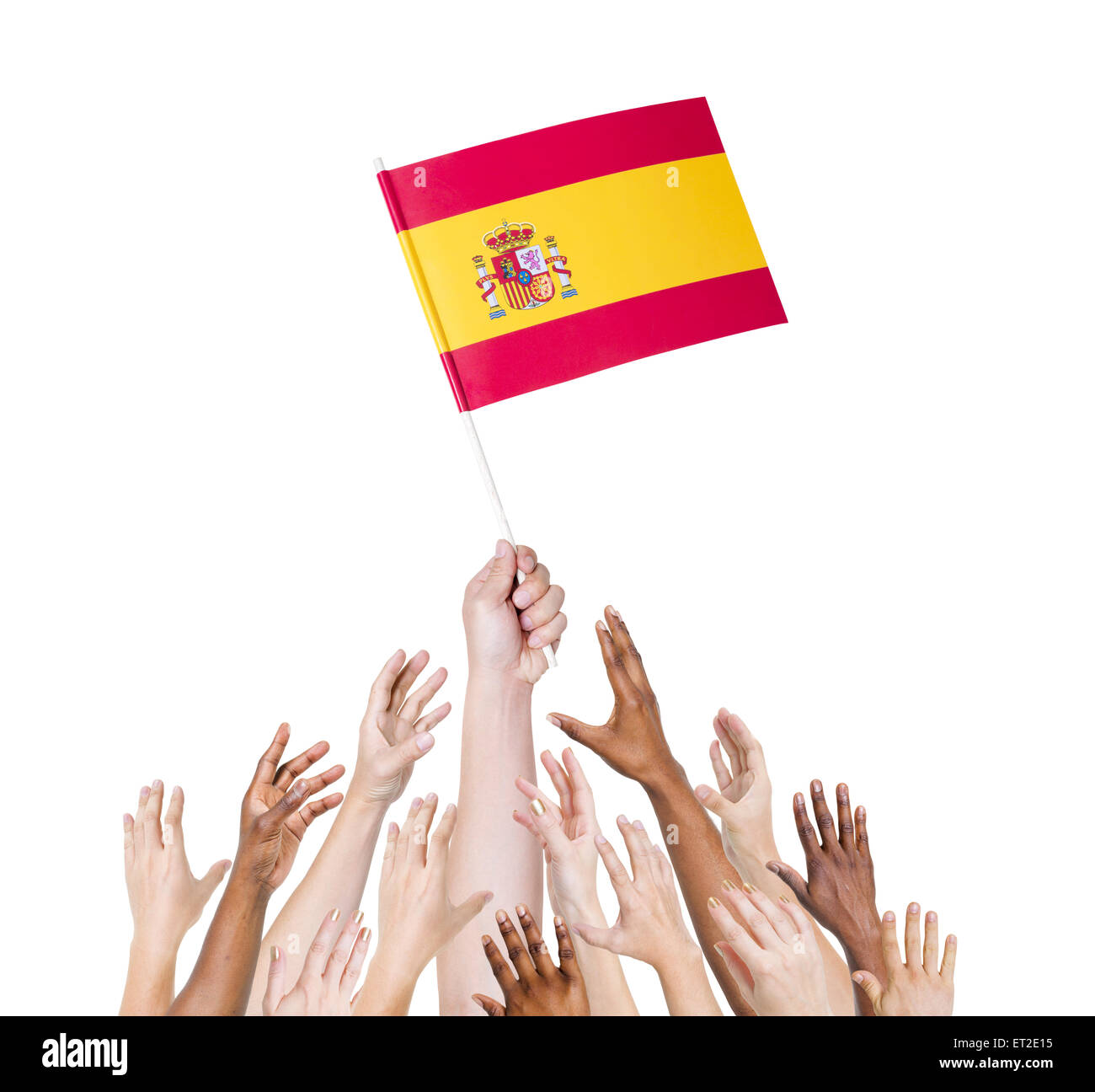 Group of multi-ethnic people reaching for and holding the flag of Spain ...