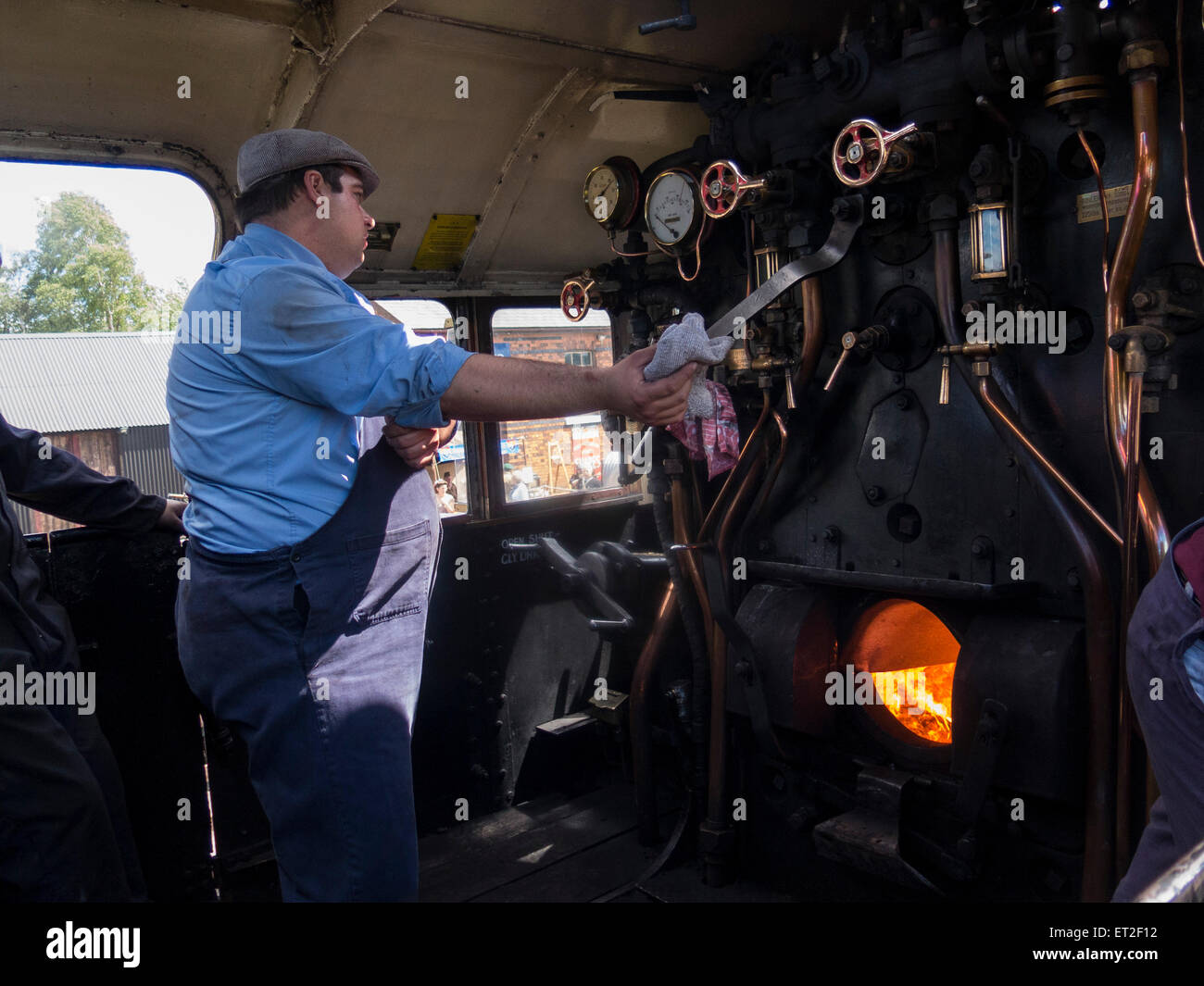 engine driver of a vintage steam locomotive at Loughborough station, on ...