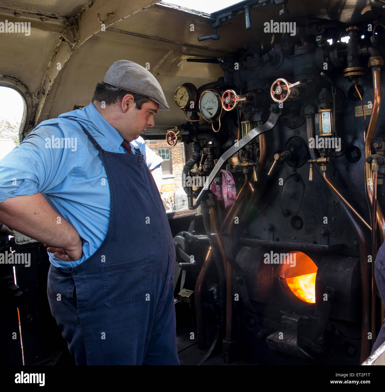 engine driver of a vintage steam locomotive at Loughborough station, on ...