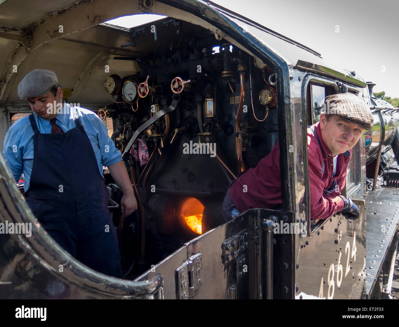 engine driver of a vintage steam locomotive at Loughborough station, on ...