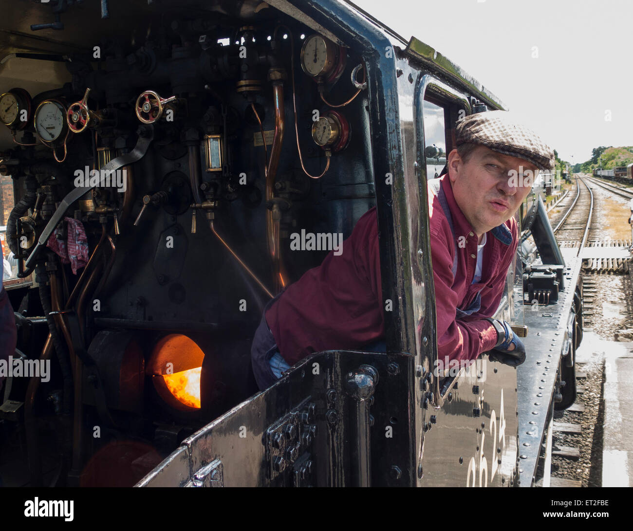 engine driver of a vintage steam locomotive at Loughborough station, on ...