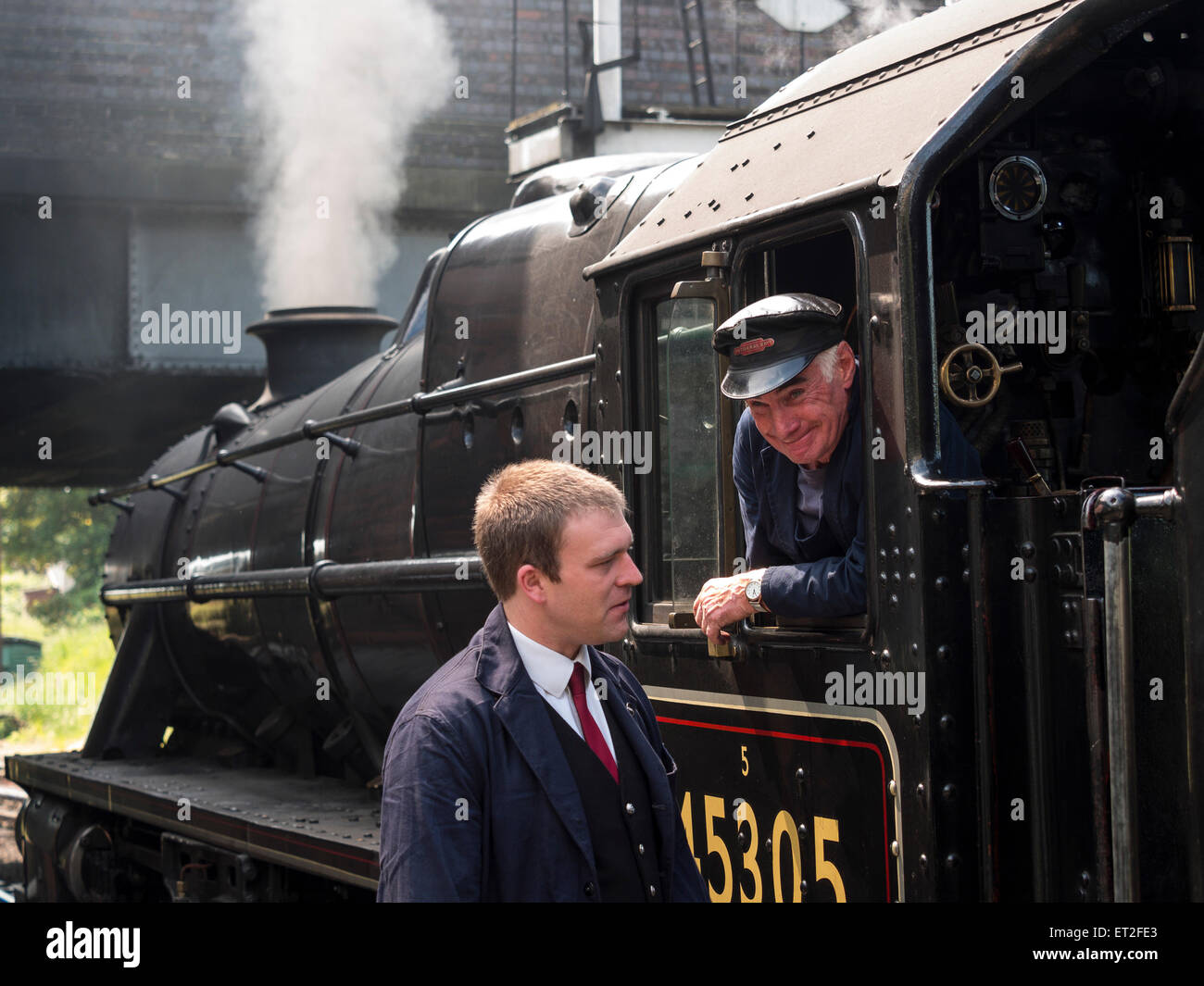 engine driver of a vintage steam locomotive at Loughborough station, on ...