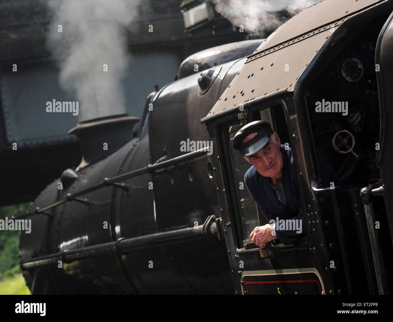 engine driver of a vintage steam locomotive at Loughborough station, on ...