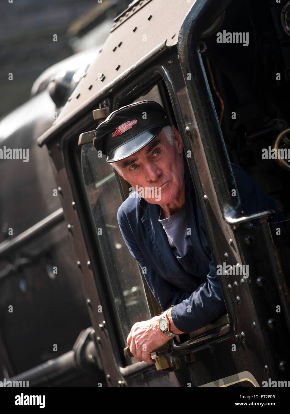 engine driver of a vintage steam locomotive at Loughborough station, on ...