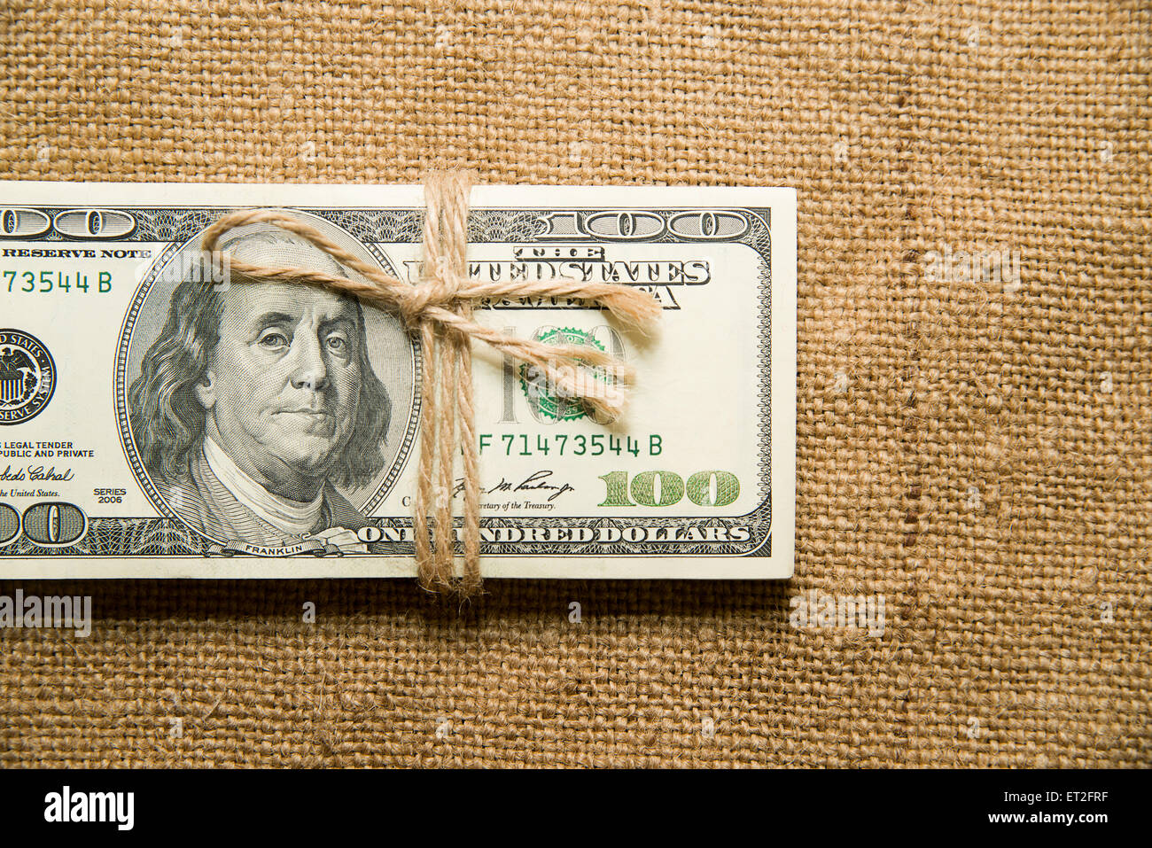 Dollars tied up with rope hi-res stock photography and images - Alamy