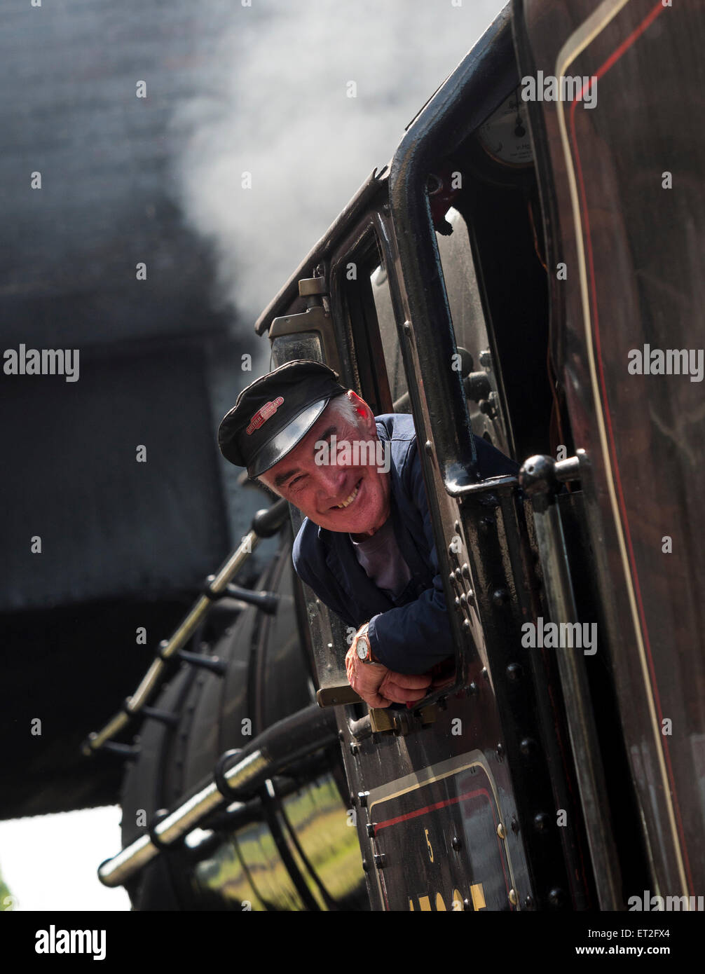 engine driver of a vintage steam locomotive at Loughborough station, on ...