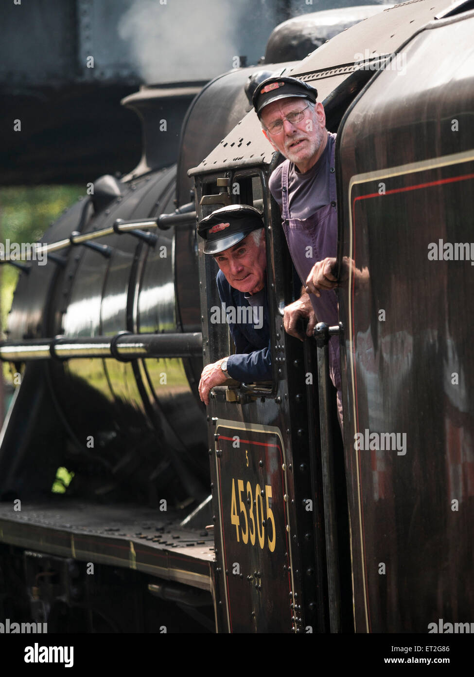 engine driver of a vintage steam locomotive at Loughborough station, on ...