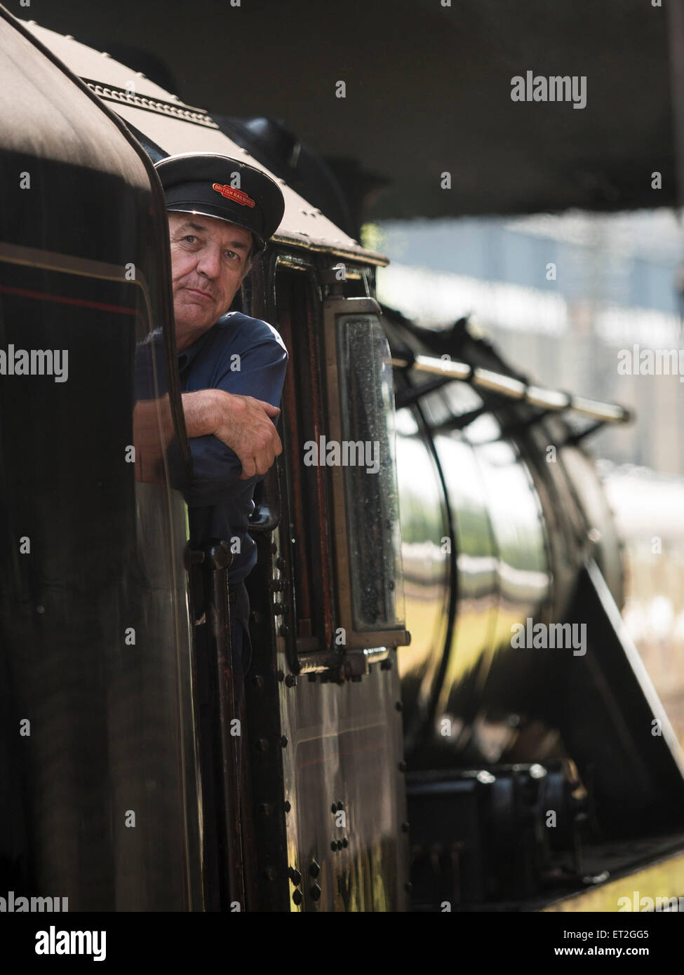 engine driver of a vintage steam locomotive at Loughborough station, on ...