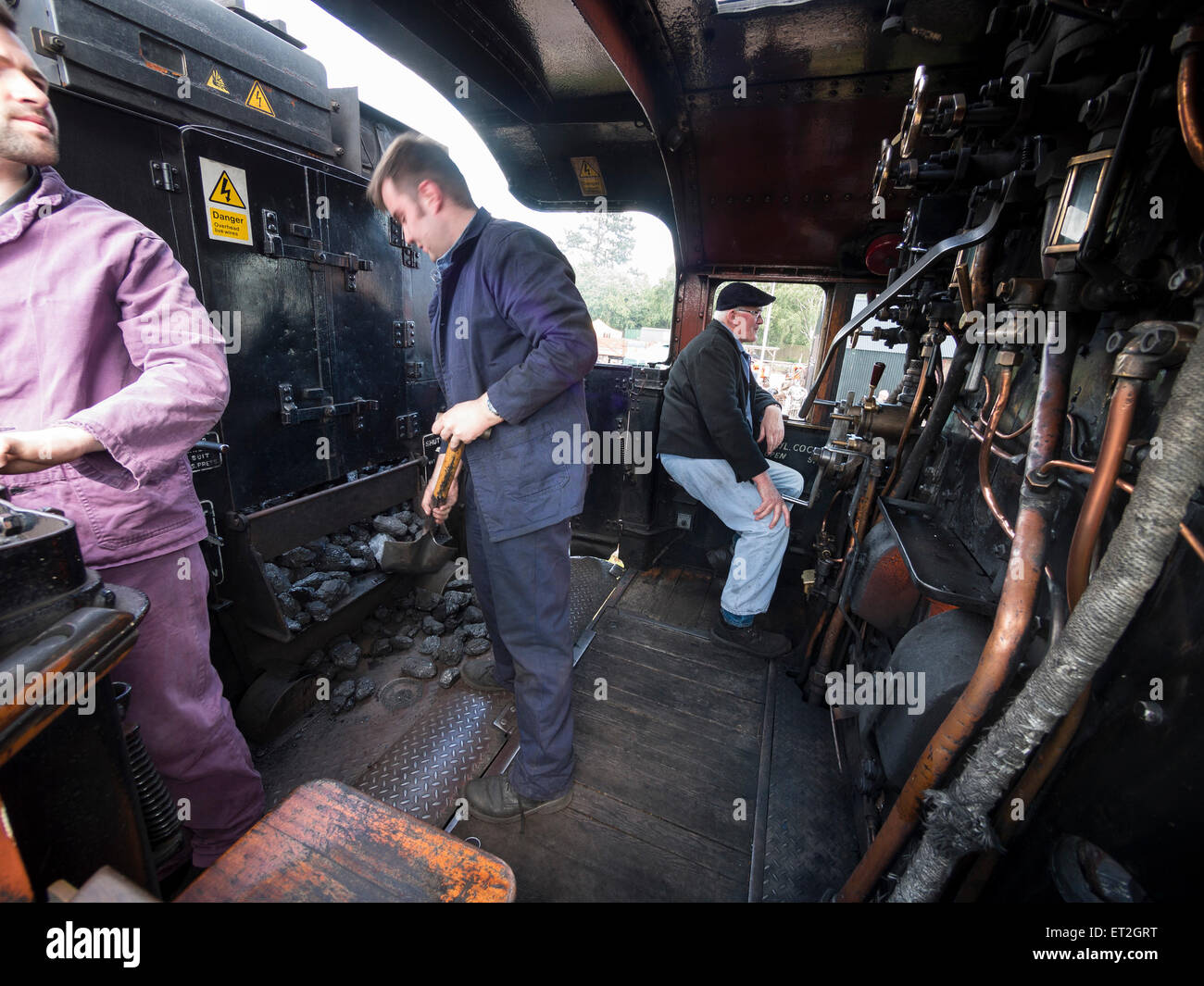 engine driver of a vintage steam locomotive at Loughborough station, on ...