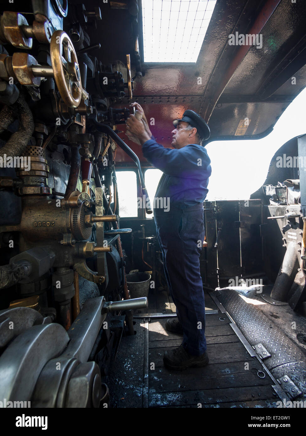 engine driver of a vintage steam locomotive at Loughborough station, on ...