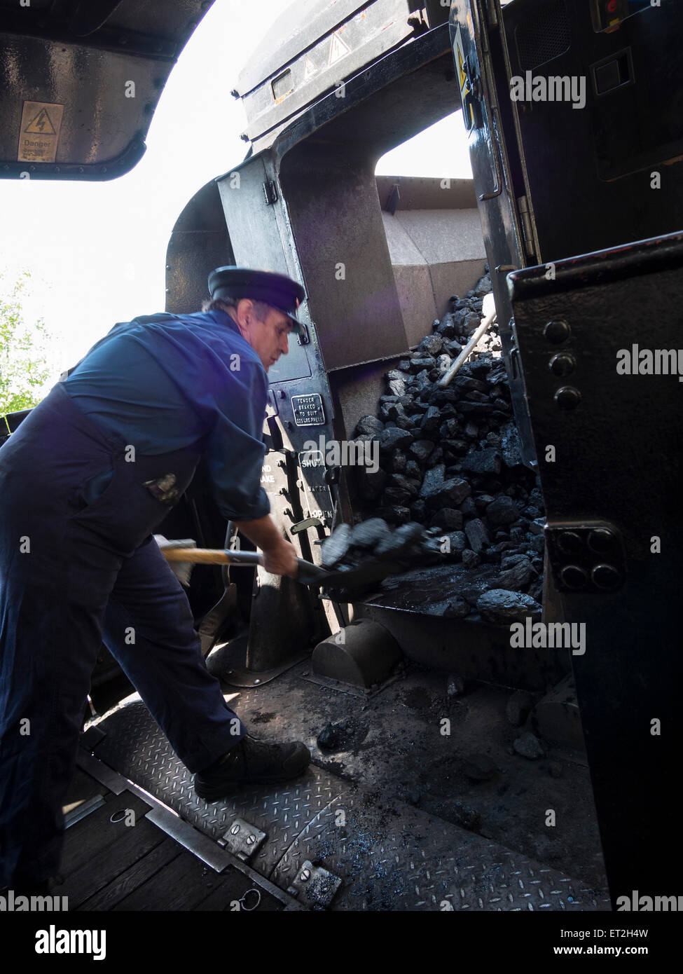 engine driver of a vintage steam locomotive at Loughborough station, on ...