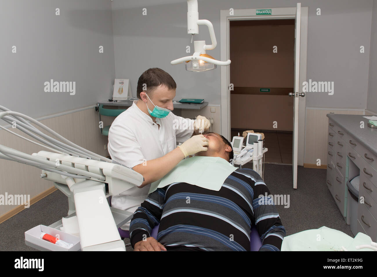 Doctor examining patient in exam hi-res stock photography and images ...