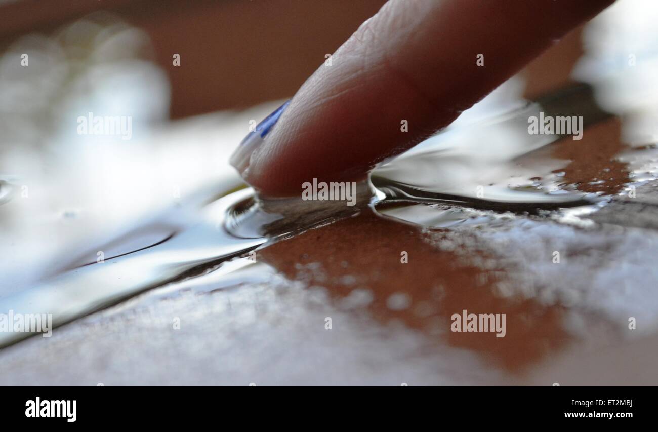 Index finger touching a water bubble Stock Photo - Alamy
