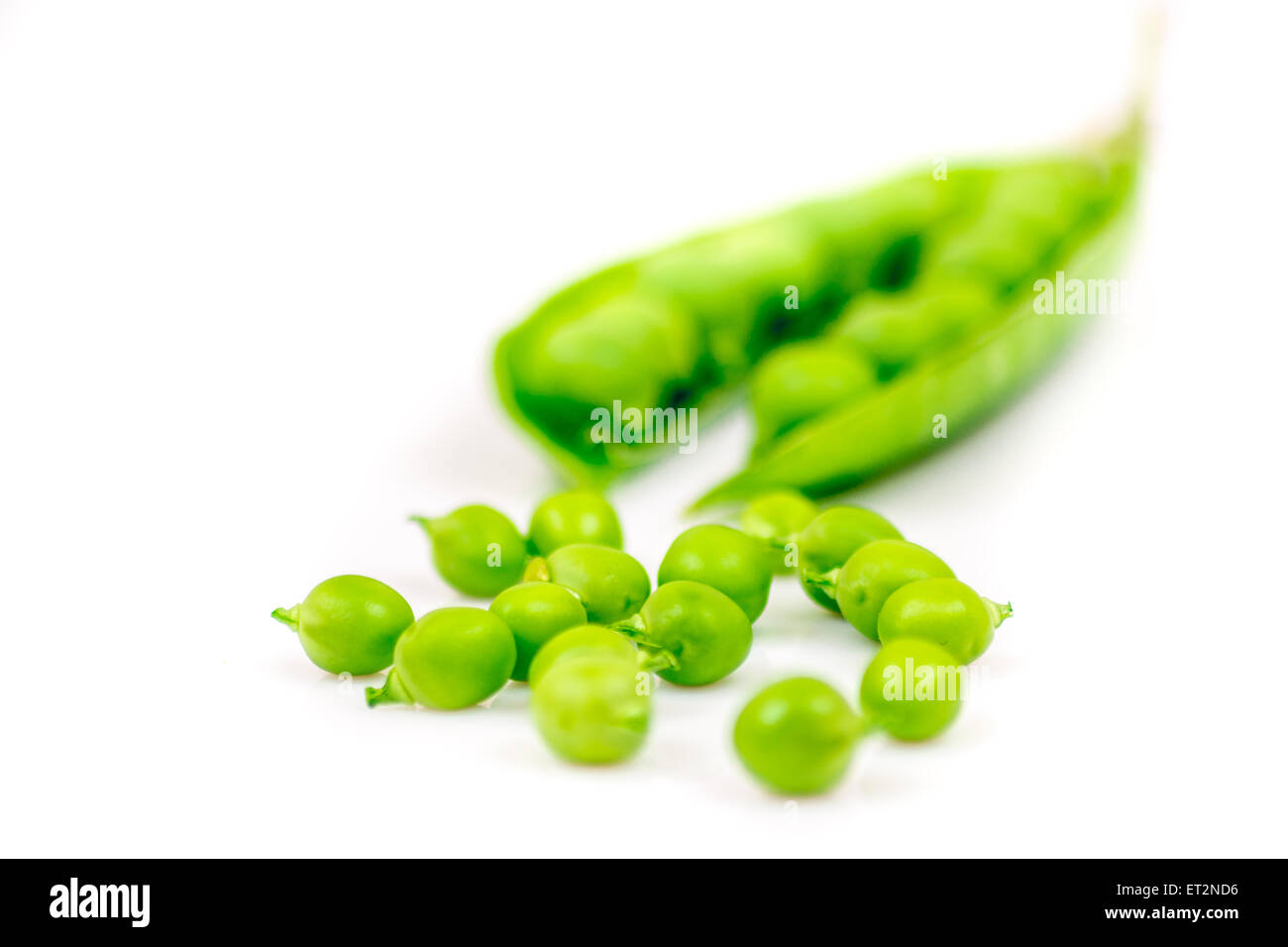 Many raw open pea isolated on white background Stock Photo - Alamy