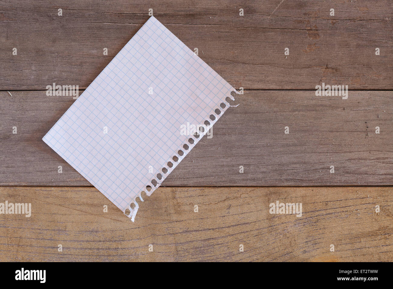sheet of grid paper over a wooden surface Stock Photo - Alamy