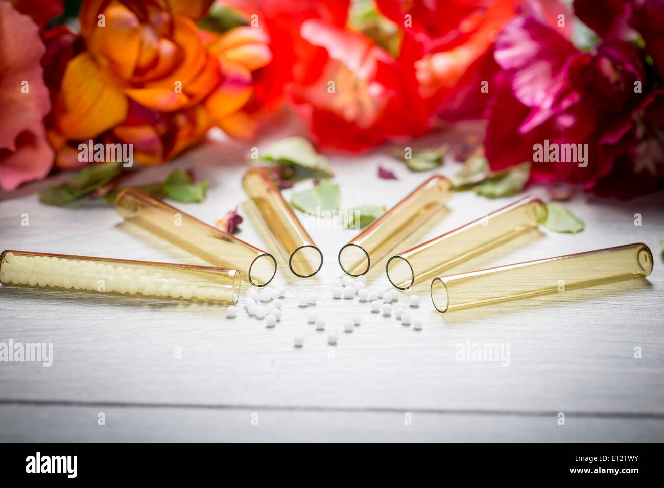 some small glass tubes with homeopathy globules and flowers Stock Photo ...