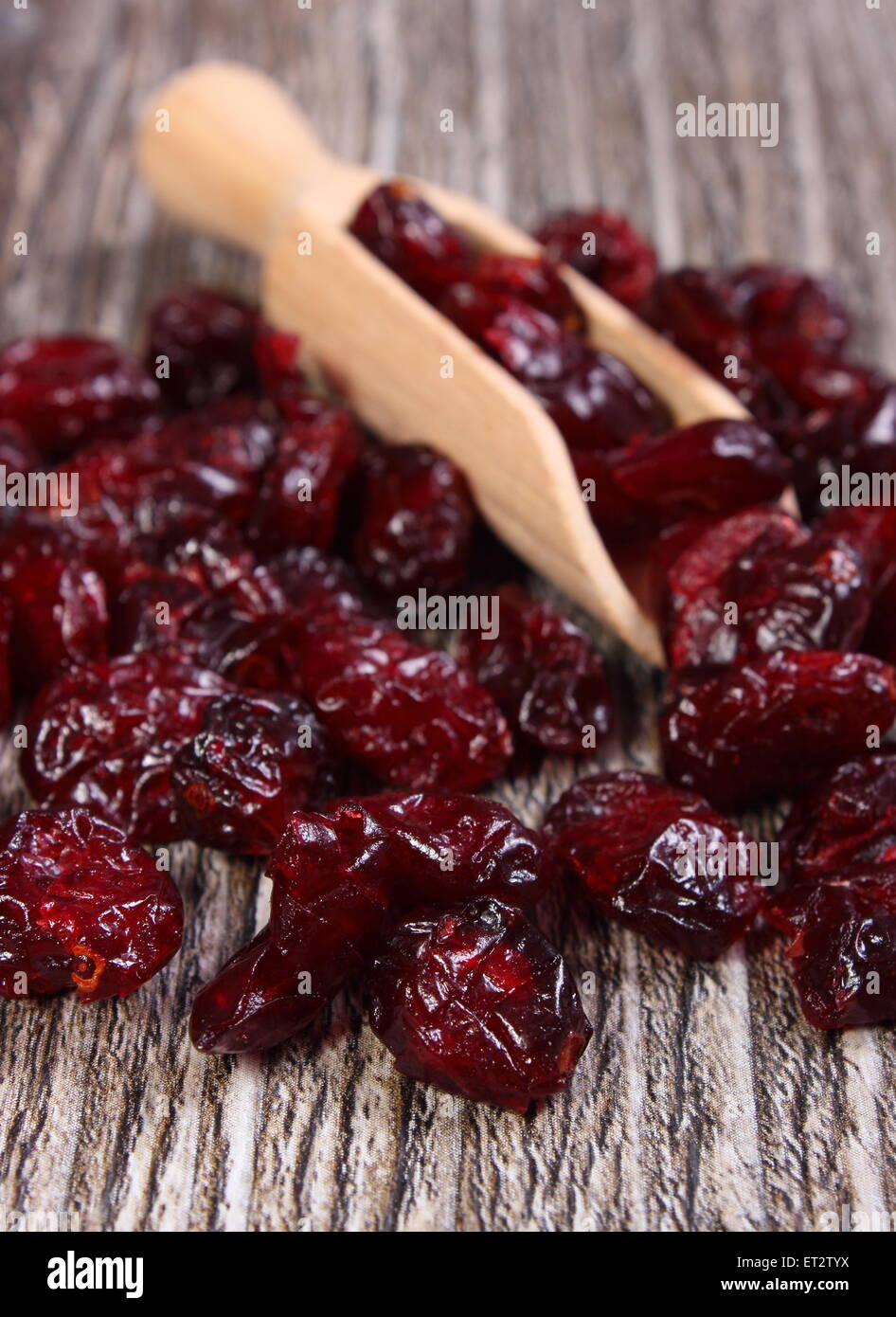 Heap of red cranberries with spoon on wooden table, concept for healthy ...