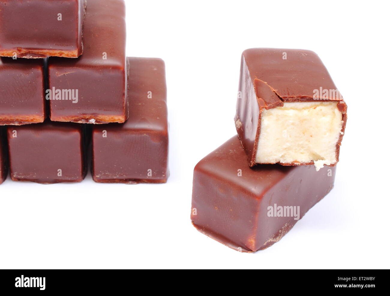 Stack of chocolate sweets isolated on white background Stock Photo - Alamy