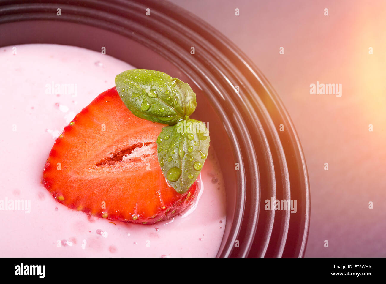 quark with strawberry in a black asian bowl Stock Photo - Alamy