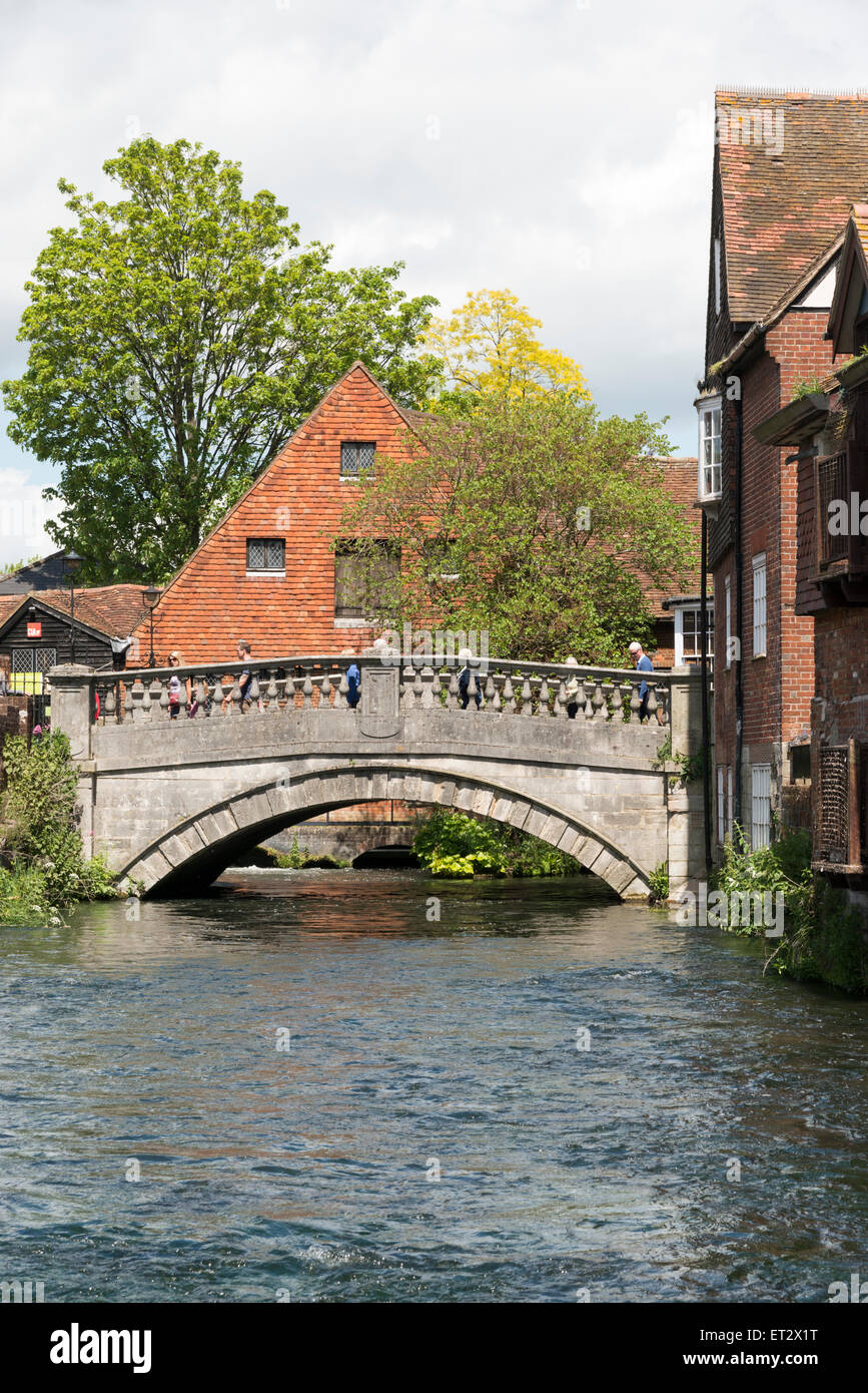 The River Itchen in Winchester UK in summer with people walking on the ...