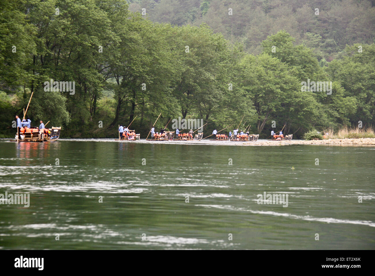 rafting on a bamboo raft in the beautiful mountain gorge Stock Photo ...