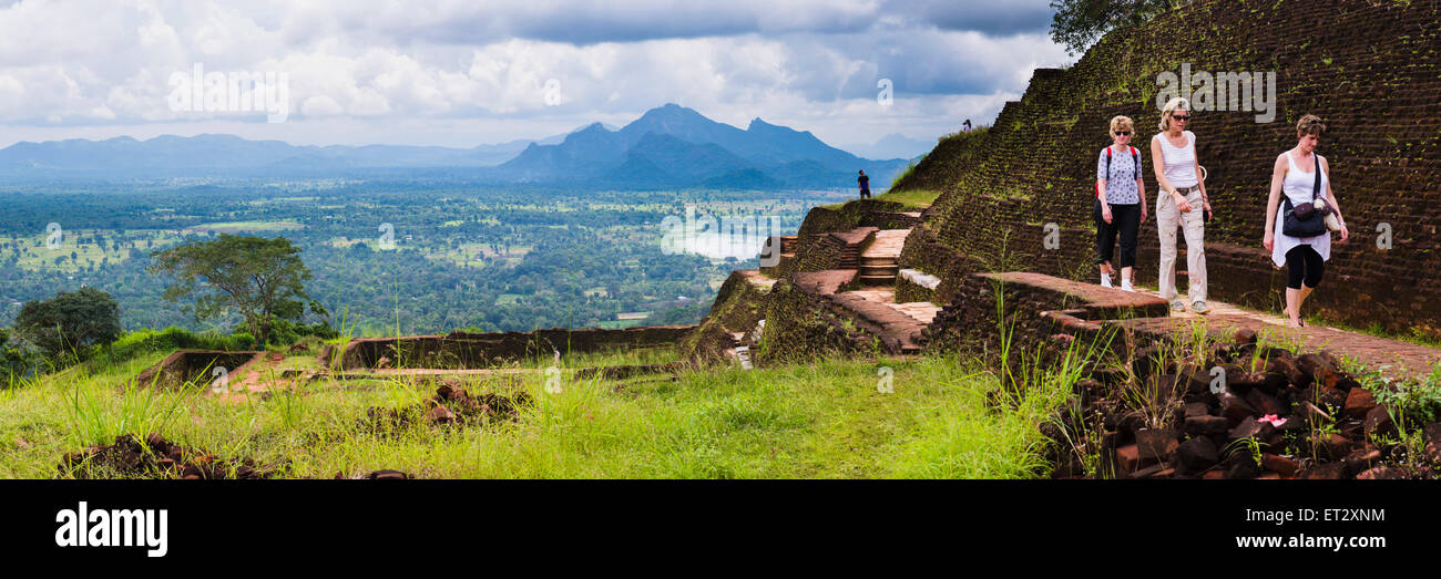 Sigiriya Rock, tourists exploring the ruins of King Kassapa's Palace at ...