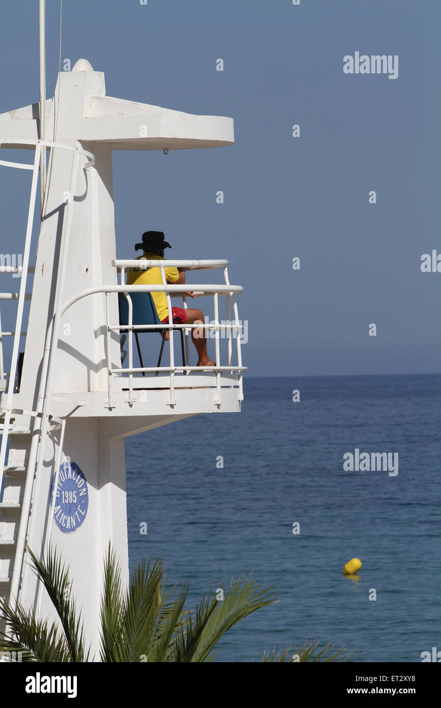 Life Guard in Tower on Beach with sun hat (credit image © Jack Ludlam ...