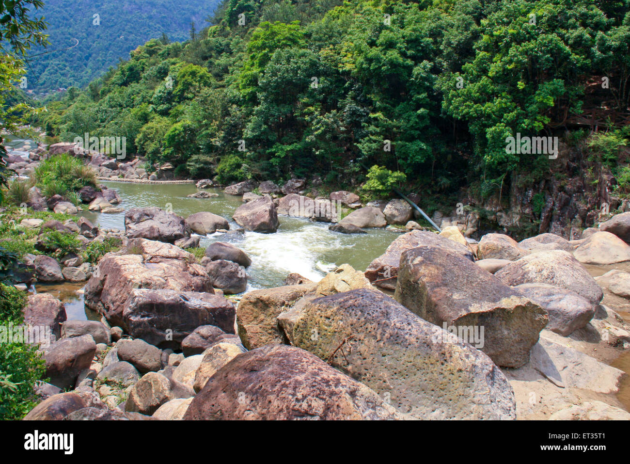 Cool water and large rocks of a mountain river Stock Photo - Alamy