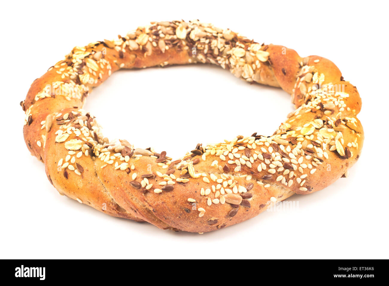 Bagel with various seeds isolated on a white Stock Photo - Alamy