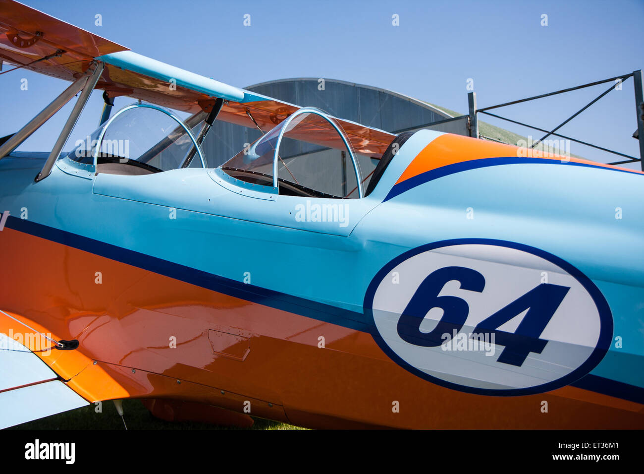 light aircraft, modern biplane orange and blue details and takeoff ...