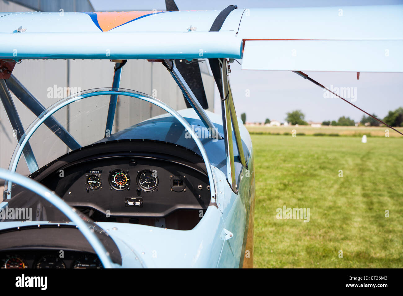 light aircraft, modern biplane orange and blue details and takeoff ...