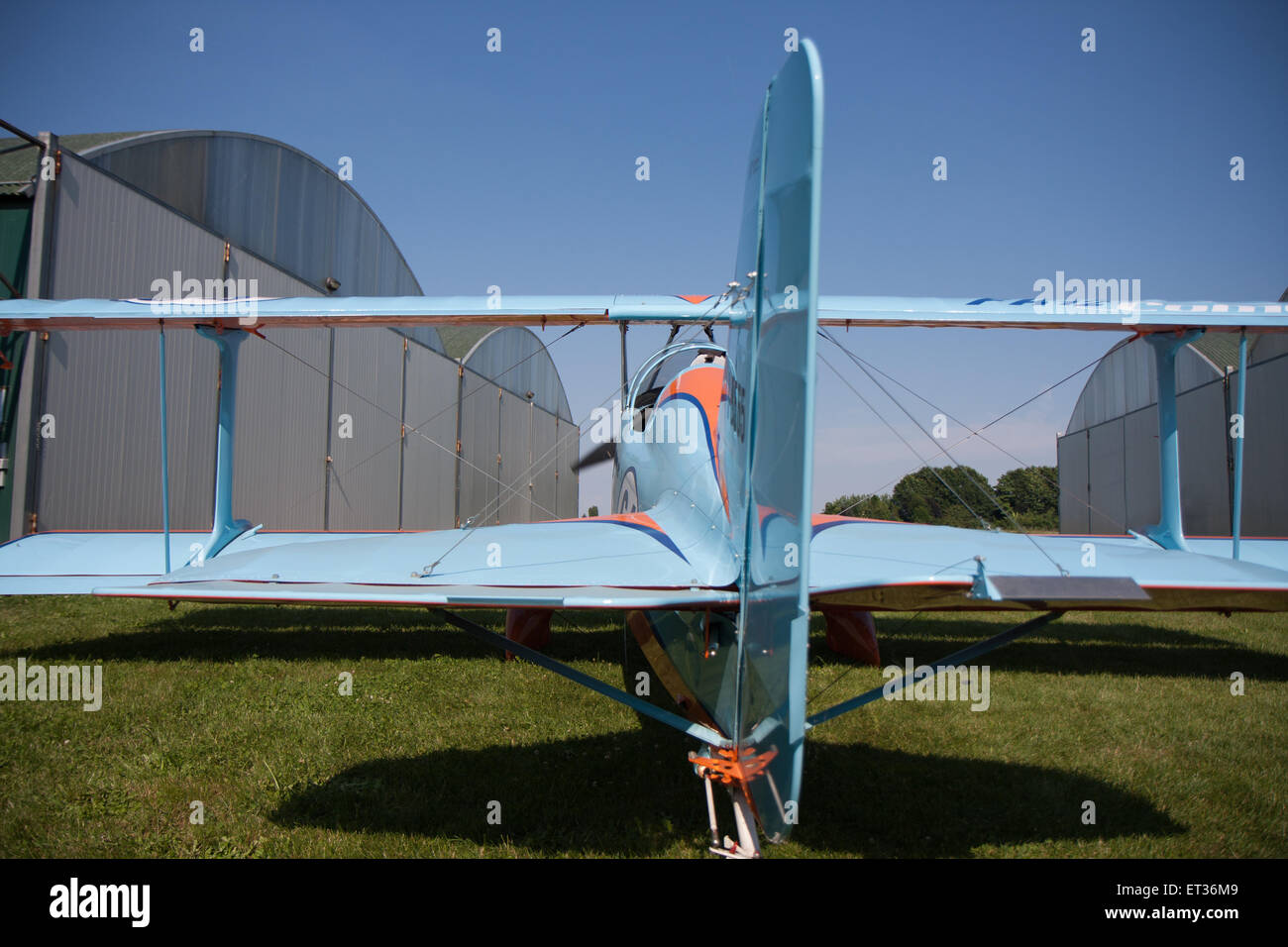 light aircraft, modern biplane orange and blue details and takeoff ...
