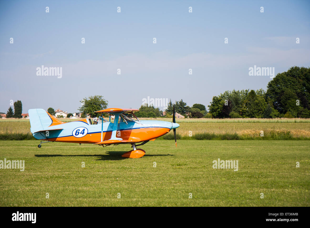 light aircraft, modern biplane orange and blue details and takeoff ...