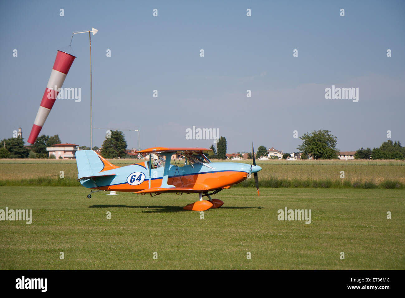 light aircraft, modern biplane orange and blue details and takeoff ...