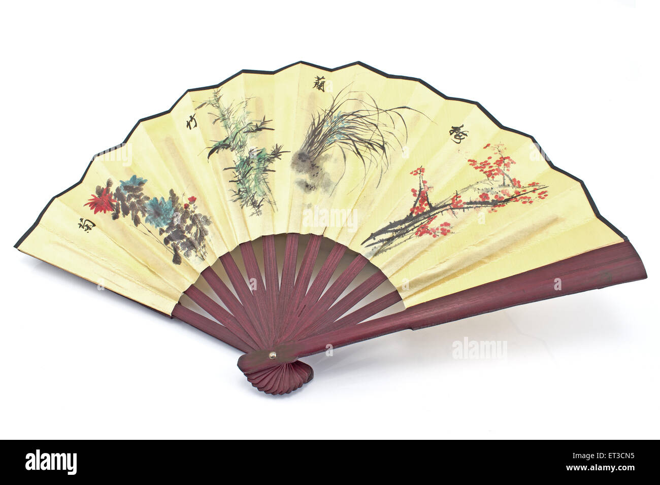 Wooden yellow oriental fan on white background Stock Photo - Alamy