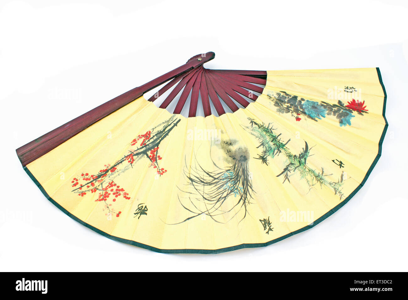 Wooden yellow oriental fan on white background Stock Photo - Alamy