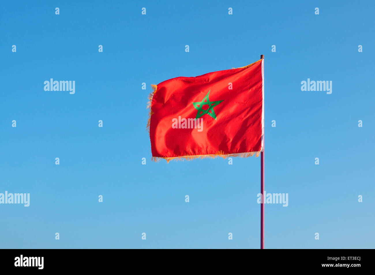 morocco national symbol pole flag waving over blue sky Stock Photo - Alamy