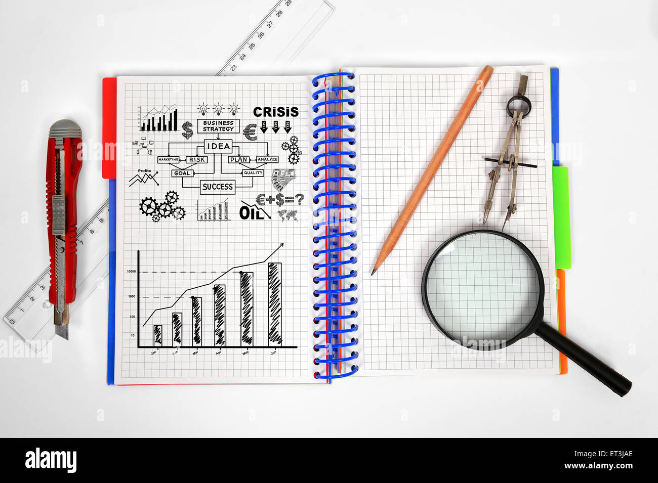 notepad with drawing business strategy and tools on desktop engineer ...