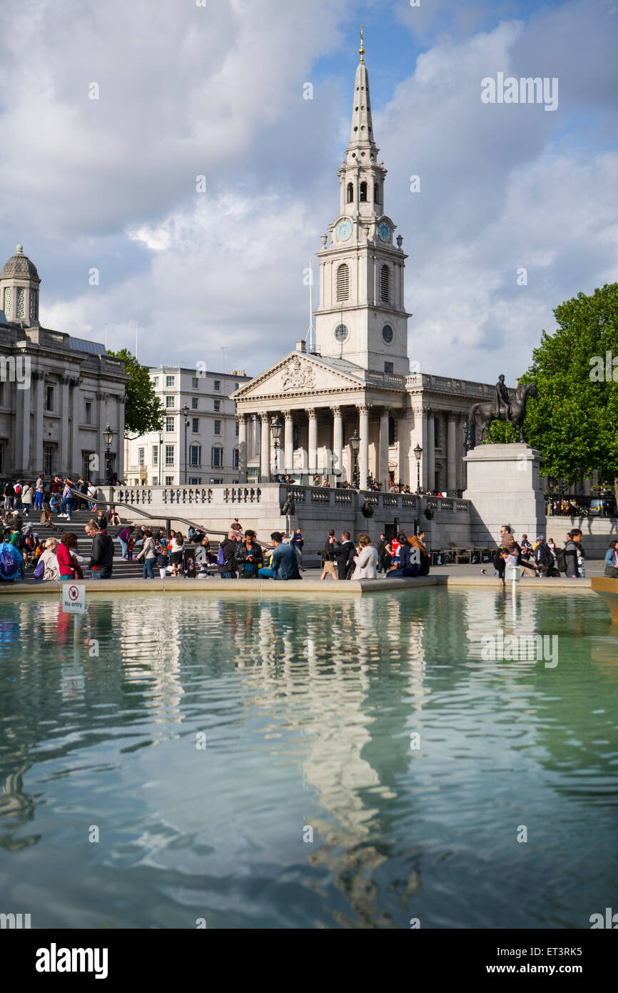 London's St Martin-in-the-Fields church, reflected in the pools on ...