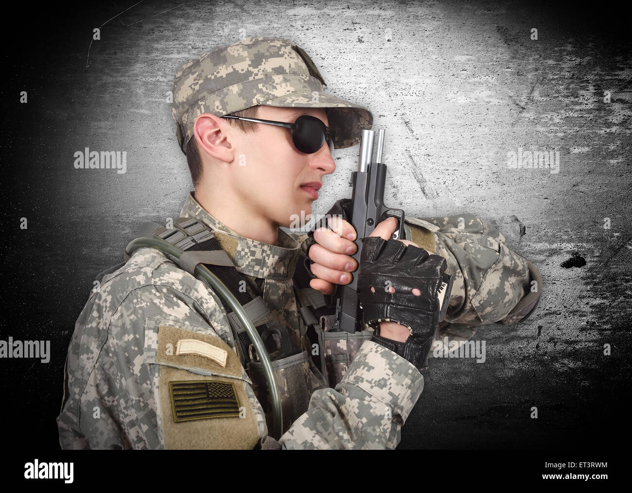 soldier with gun on a gray background Stock Photo - Alamy