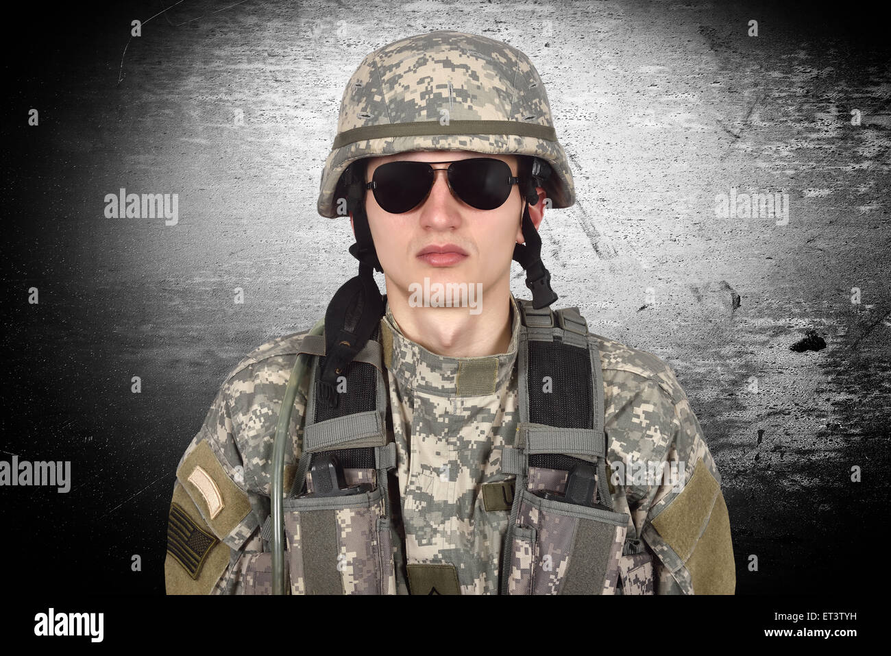 young american soldier on a gray background Stock Photo - Alamy
